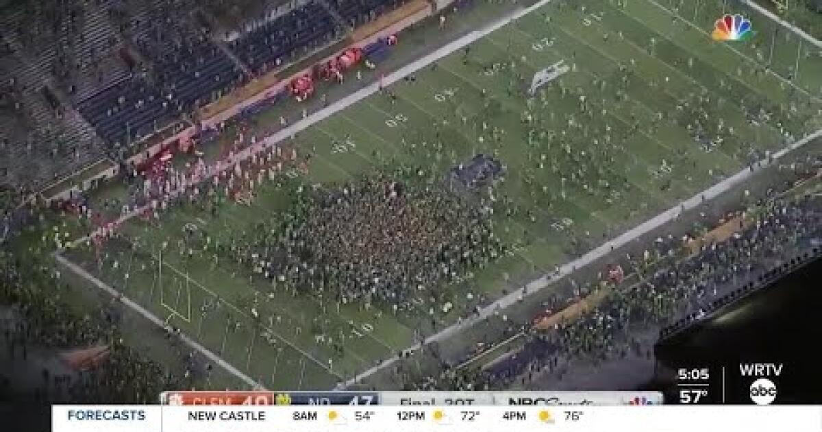 Notre Dame fans and students rush field - Los Angeles Times