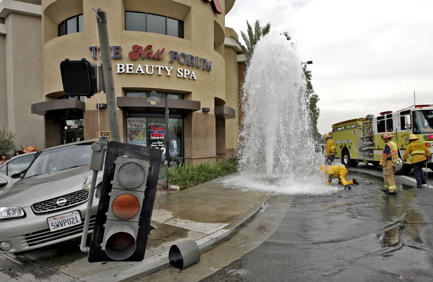 Photo Gallery: Fire hydrant sheared off by vehicle - Los Angeles Times