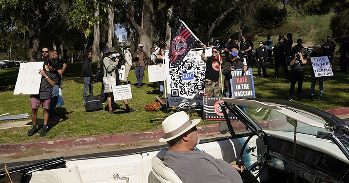 Small crowd protests outside Dodger Stadium vaccination site - Los ...